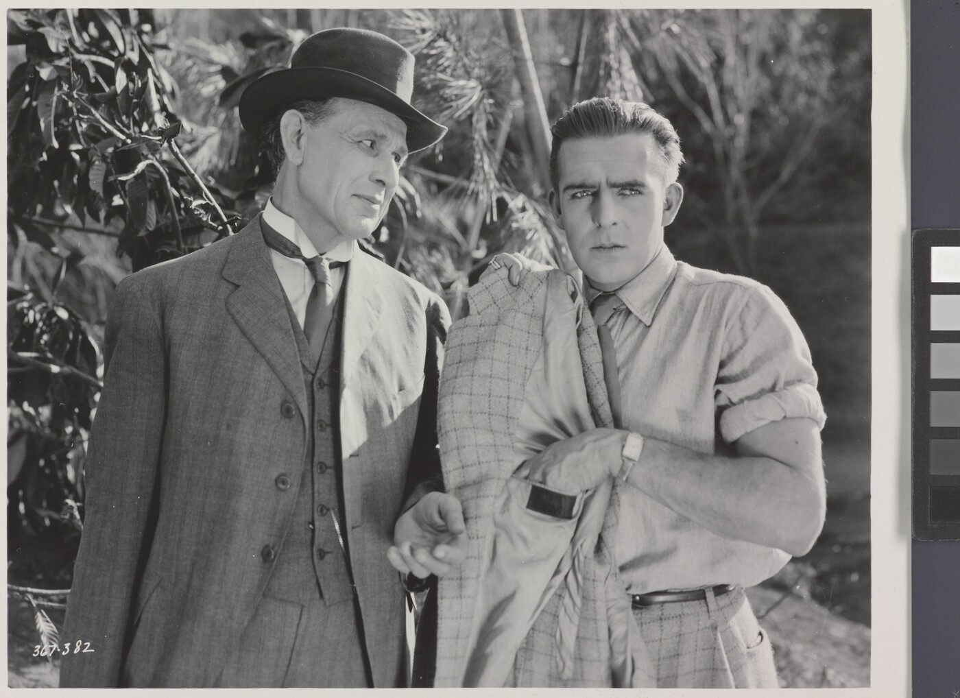 [Charles Ogle and Wallace Reid standing in wooded landscape, "Affairs ...