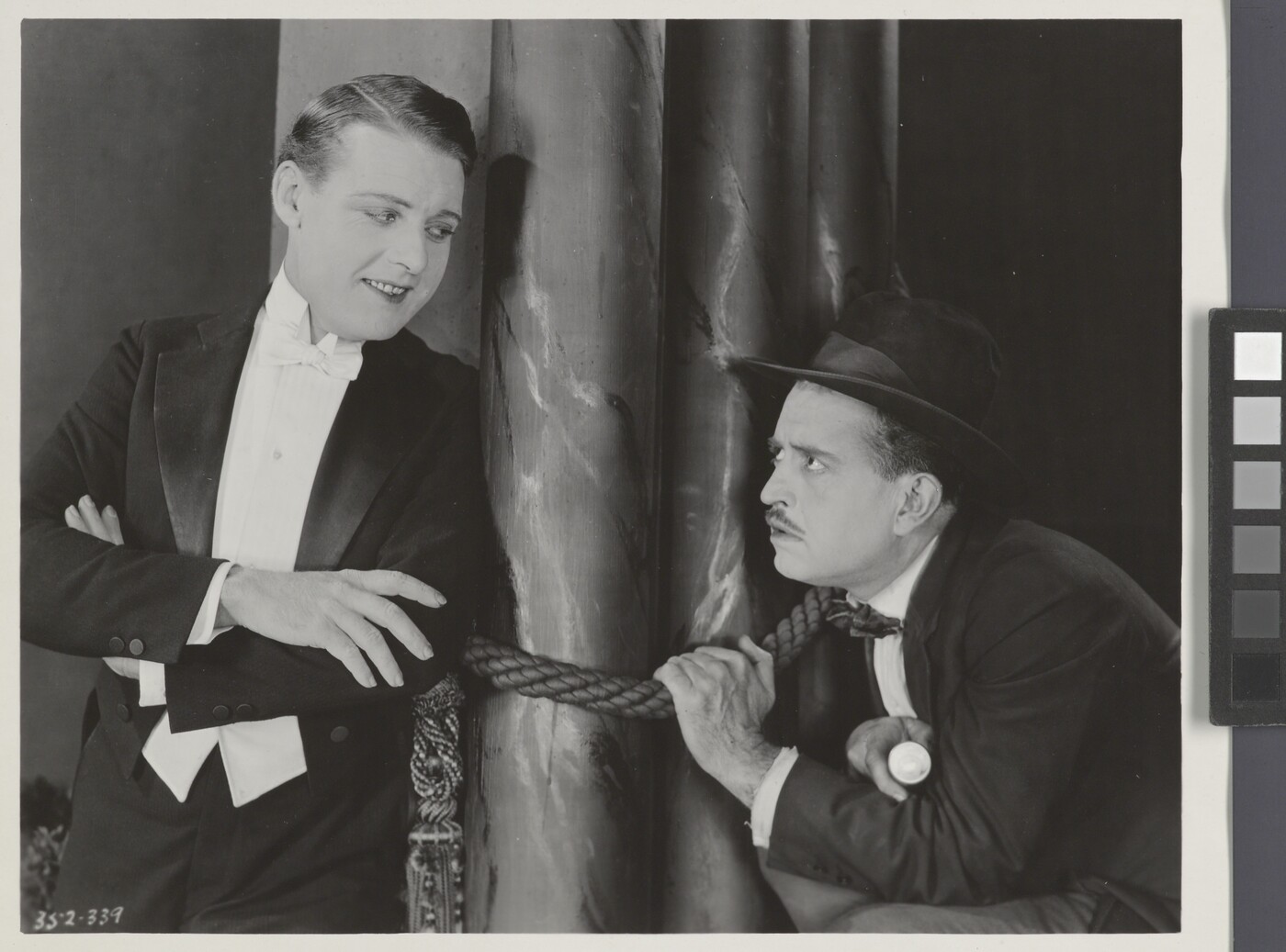 [Forrest Stanley looking around curtain at Clarence Burton, "Forbidden ...